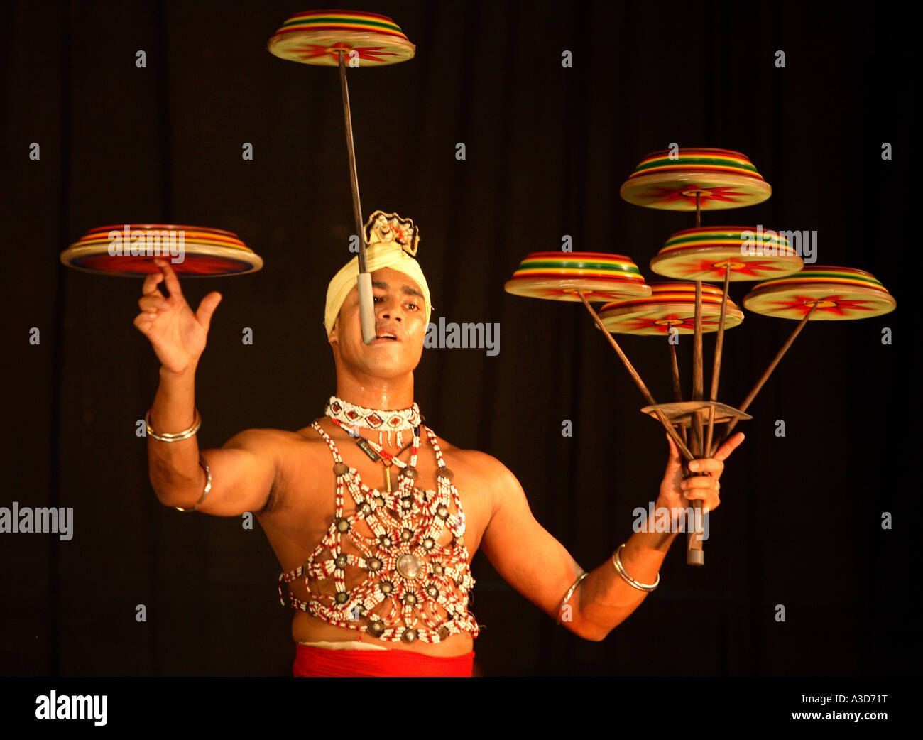Portrait of world famous Kandy dancers in action performing on stage in ...