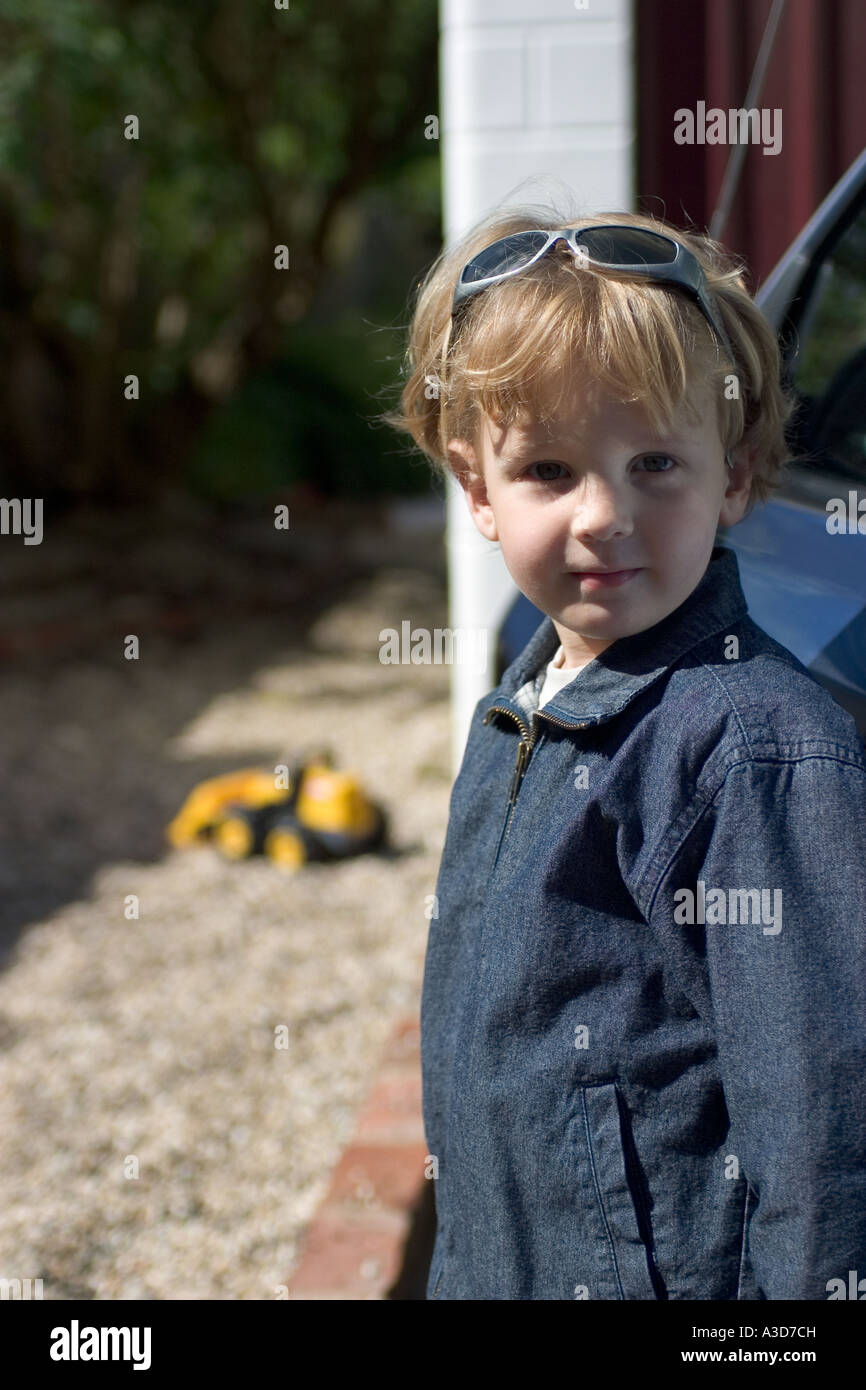 Boy leaning against car hi-res stock photography and images - Alamy
