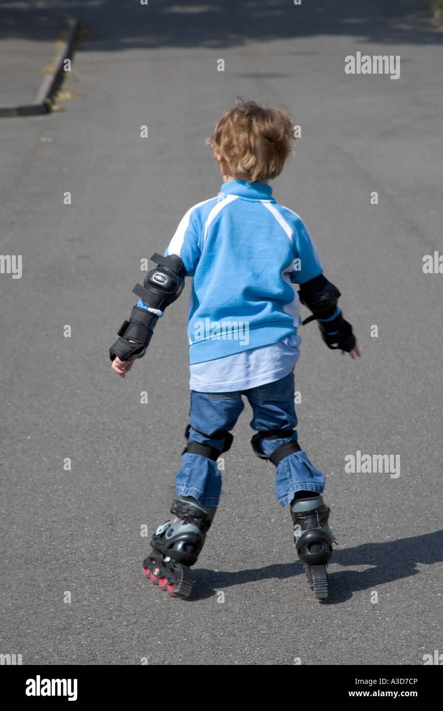 Young boy on rollerblades Stock Photo - Alamy