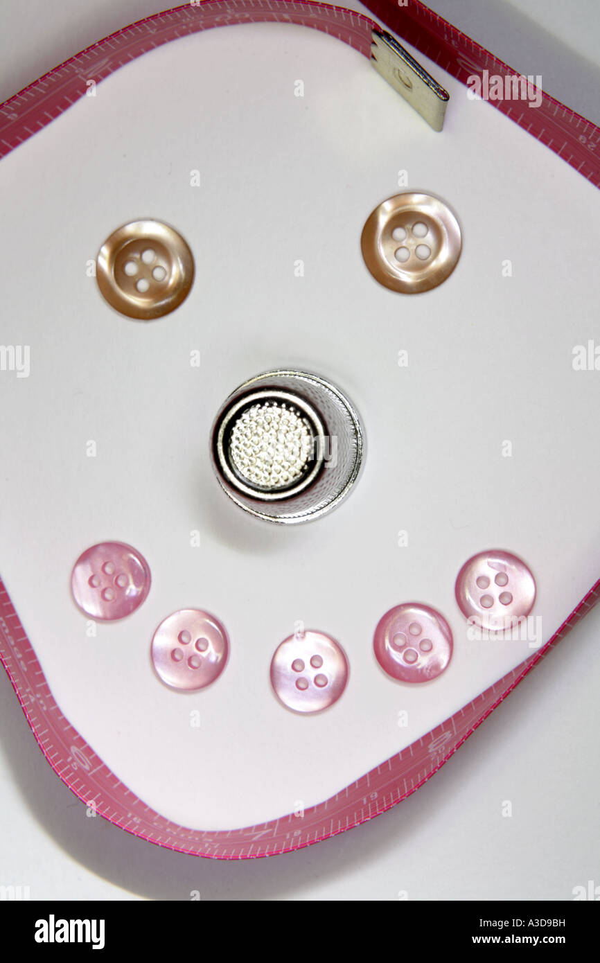 Face made from buttons, thimble and tape measure Stock Photo - Alamy