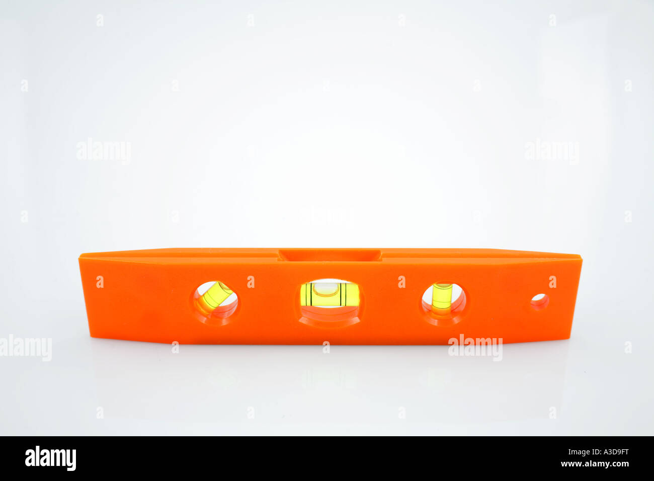 Orange spirit level Stock Photo - Alamy