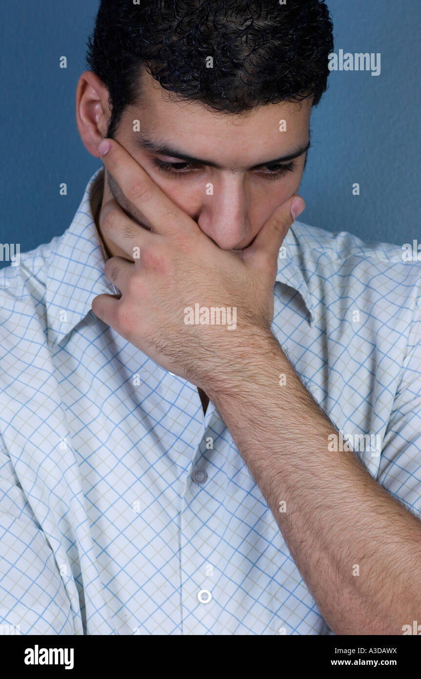 Portrait of a sad man indoors Stock Photo - Alamy