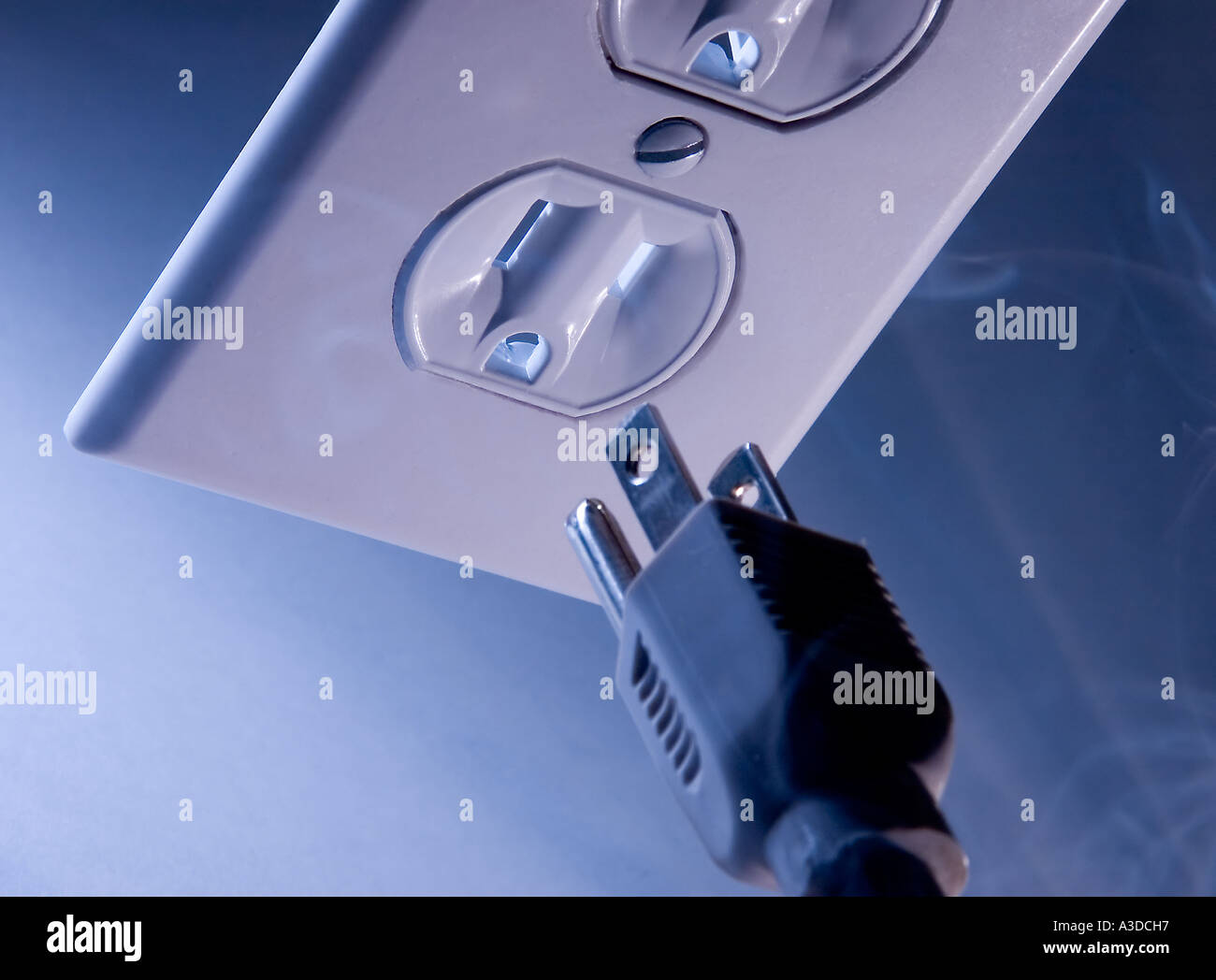 electrical plug moves through smoky space toward an empty electical ...