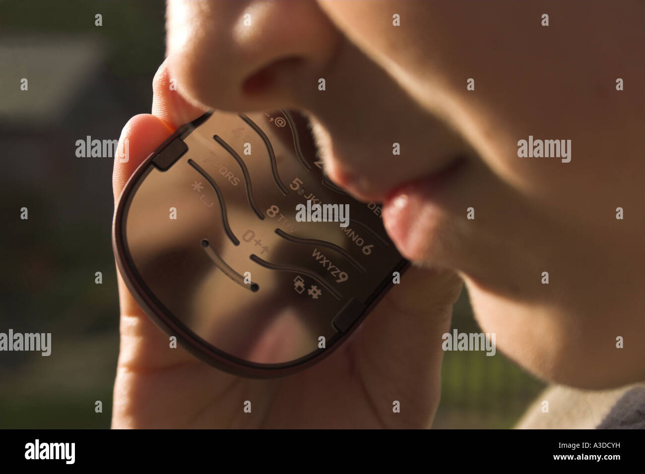 Talking / listening on a mobile phone Stock Photo - Alamy