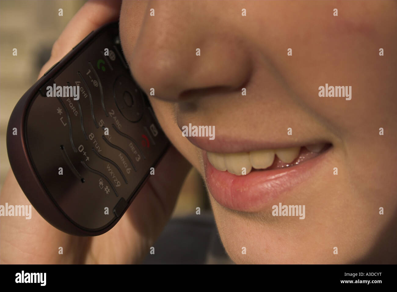 Talking / listening on a mobile phone Stock Photo - Alamy