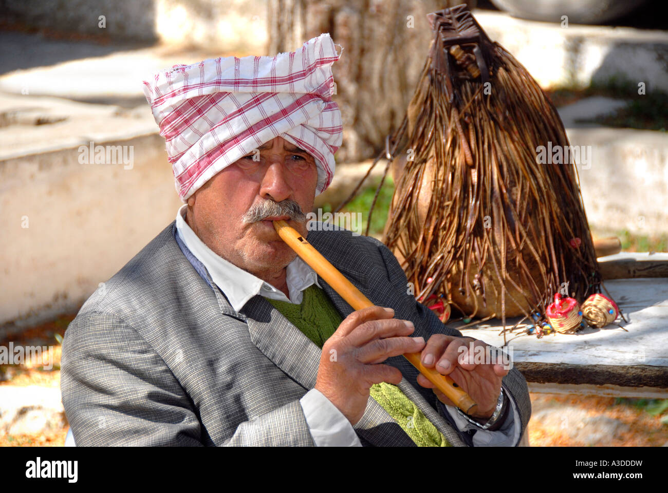 Old pipe player with kerchief at Alevkaya Forestry North Cyprus Stock ...