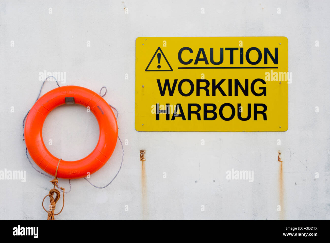 Caution Working Harbour Stock Photo - Alamy
