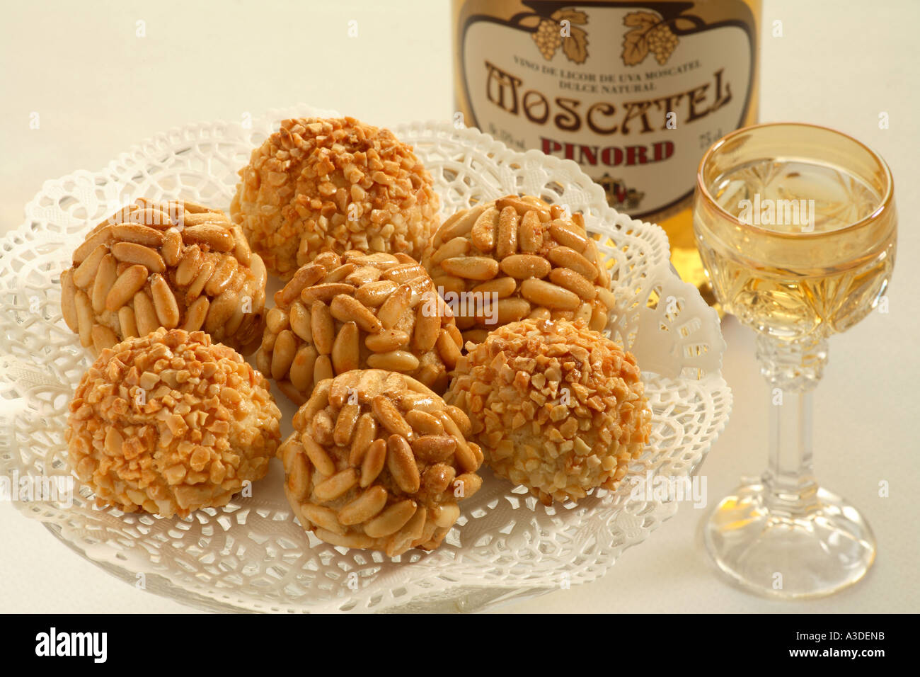 Plate of Panellets with bottle and glass of sweet muscatel wine Stock ...