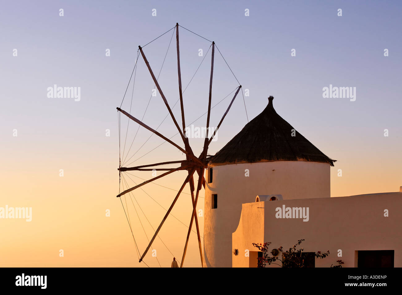 Windmill at sunset, Oia, Santorini, Greece Stock Photo - Alamy