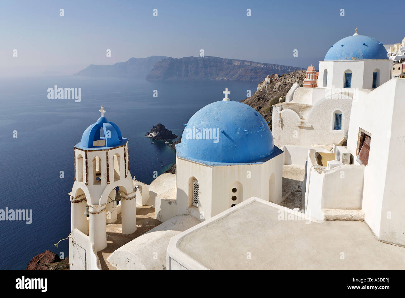 Blue cupola and a bell tower of a church, Oia, Santorini, Greece Stock ...