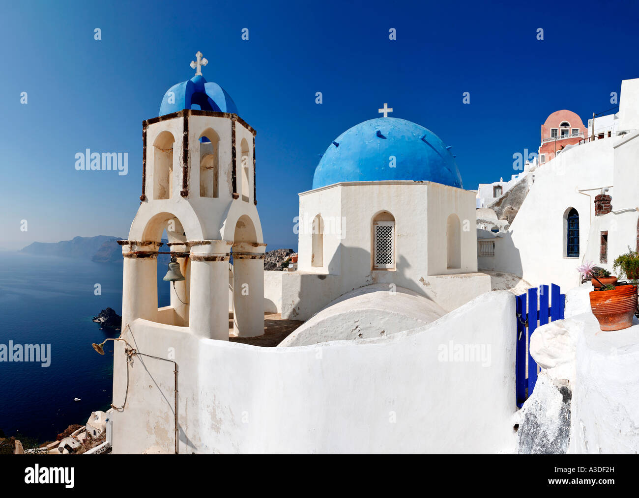 Blue cupola and a bell tower of a church, Oia, Santorini, Greece Stock ...