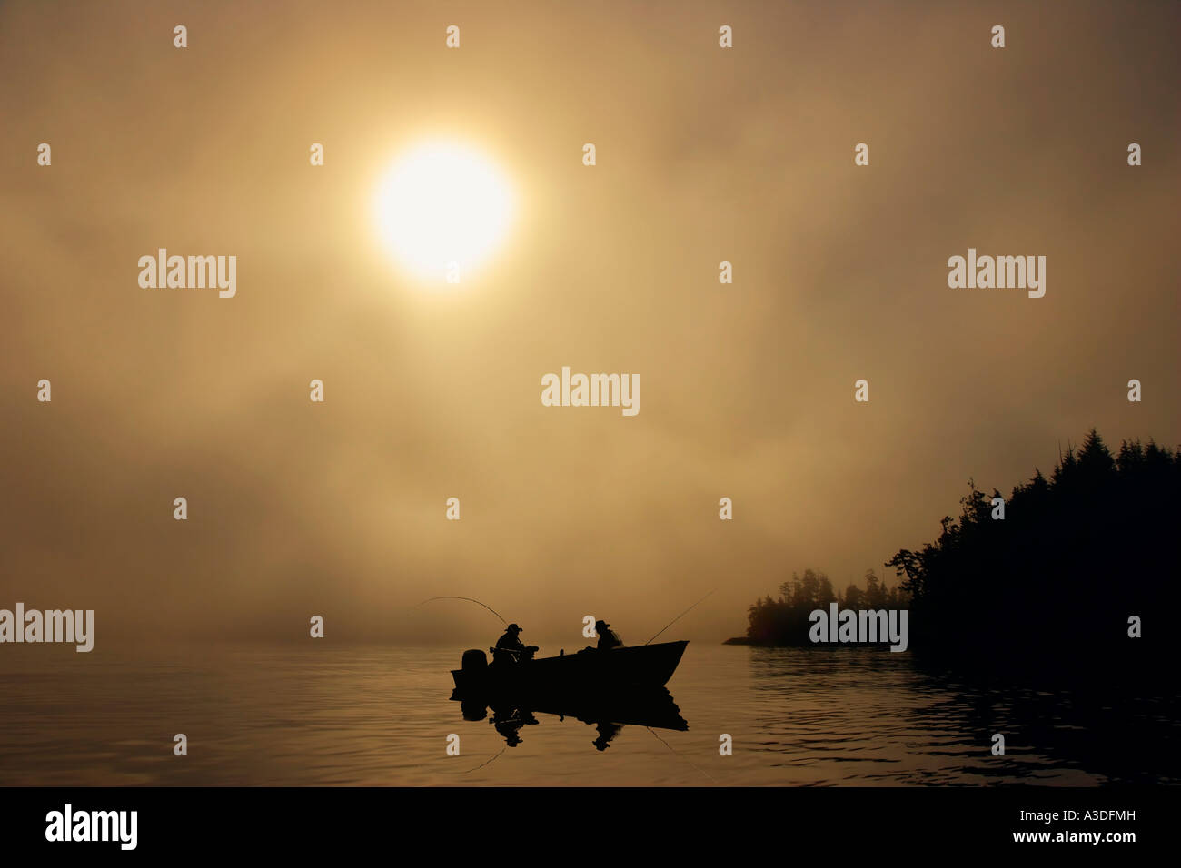 Two people fishing Stock Photo - Alamy