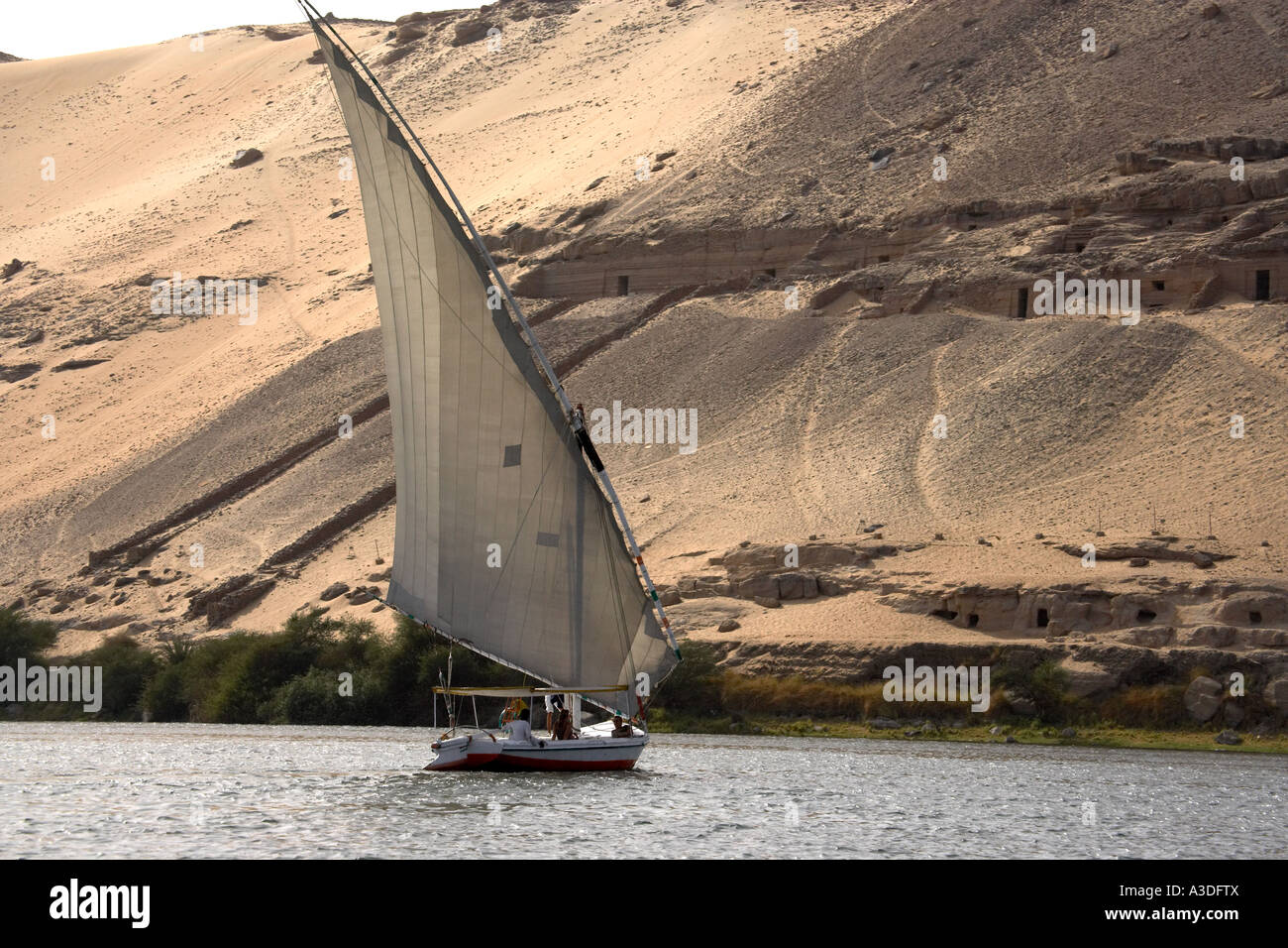 Felucca and sand dune on the Nile River Aswan Egypt Stock Photo - Alamy