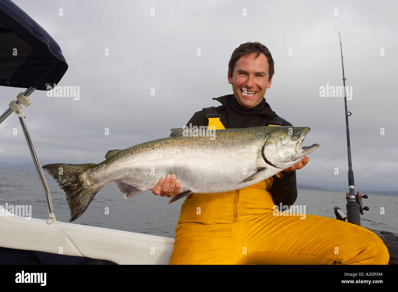 Fisherman with catch Stock Photo - Alamy