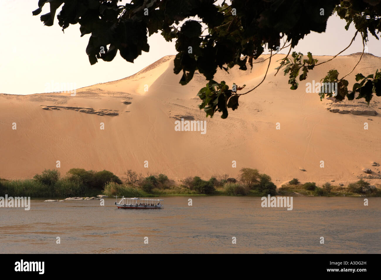 Tourboat and sand dune on the Nile River Aswan Egypt Stock Photo - Alamy