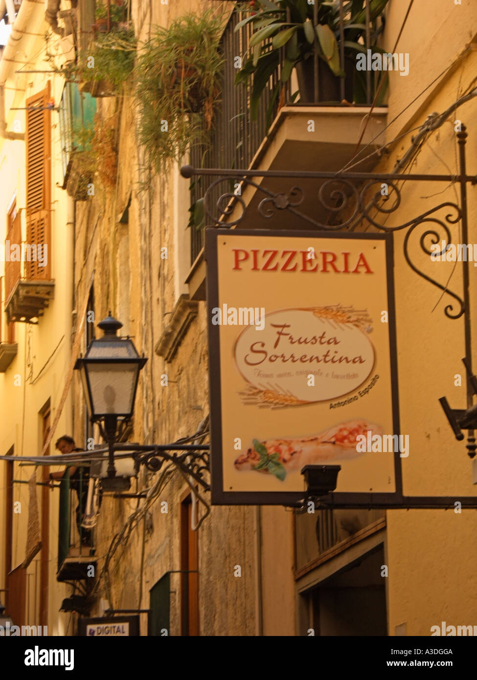 Pizzeria street sign in one of the typical narrow streets of Sorrento ...