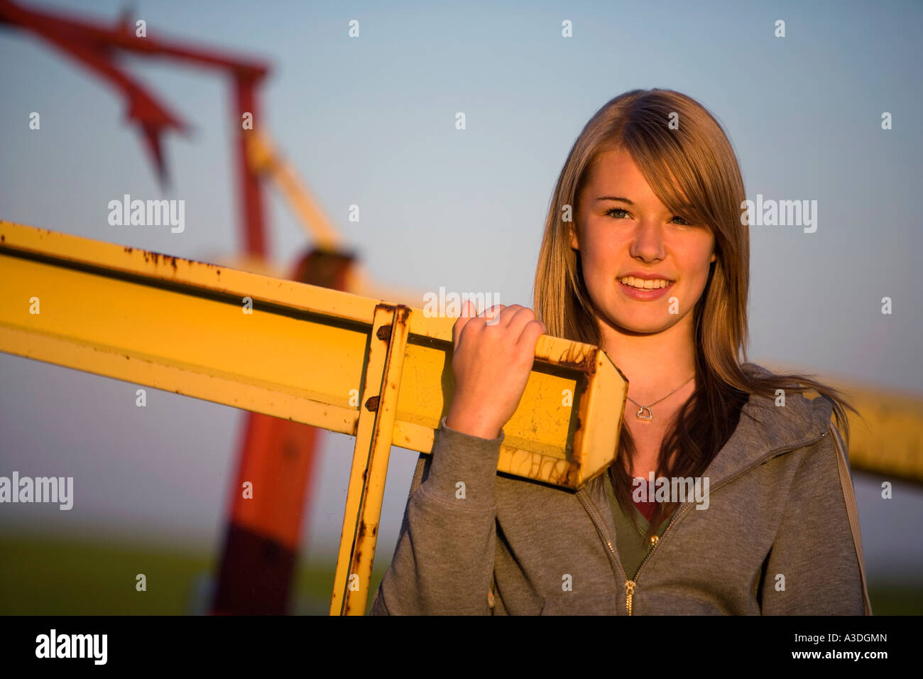 Teenage girl with farm machinery Stock Photo - Alamy