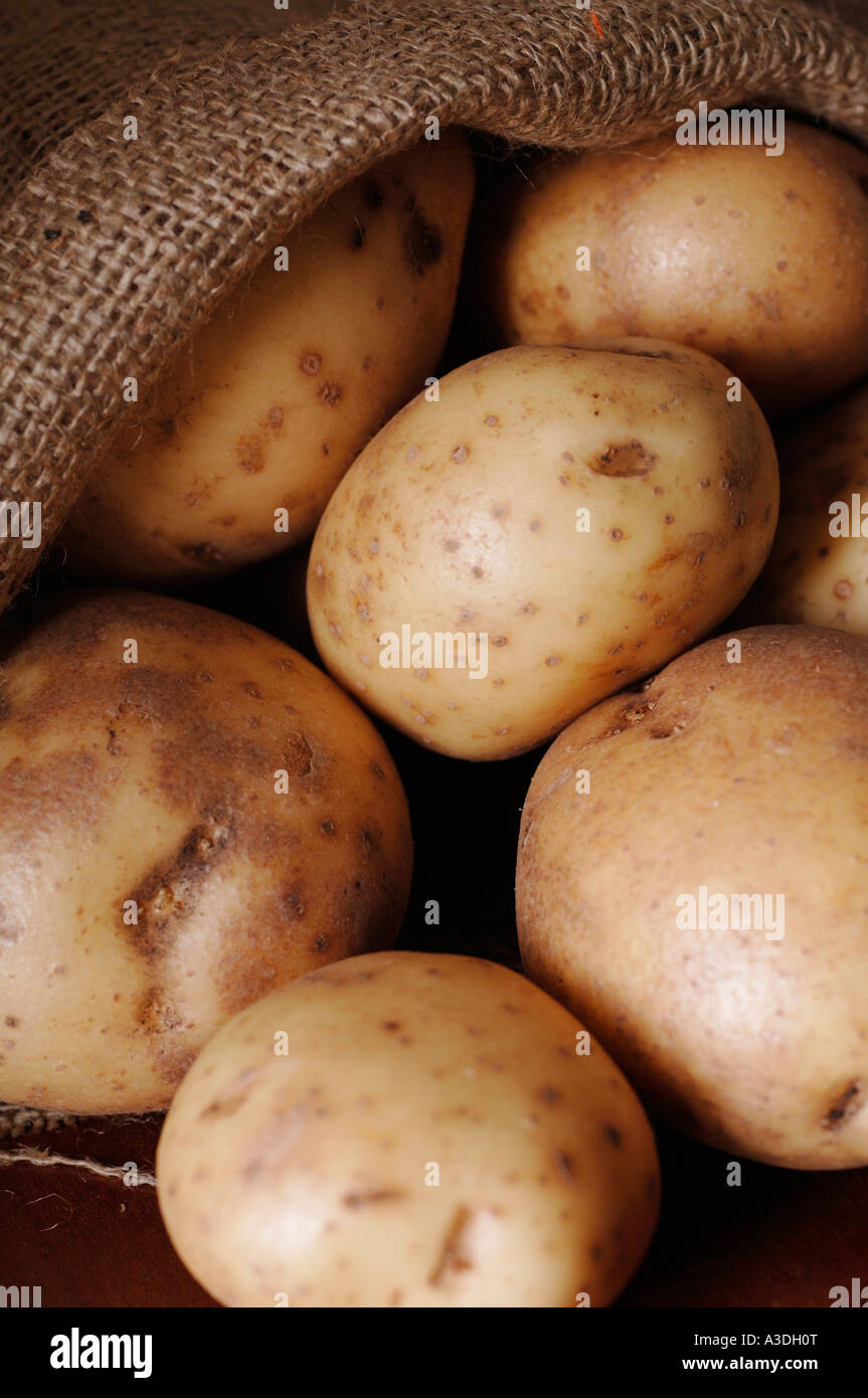 King Edward potatoes spilling from sack Stock Photo - Alamy