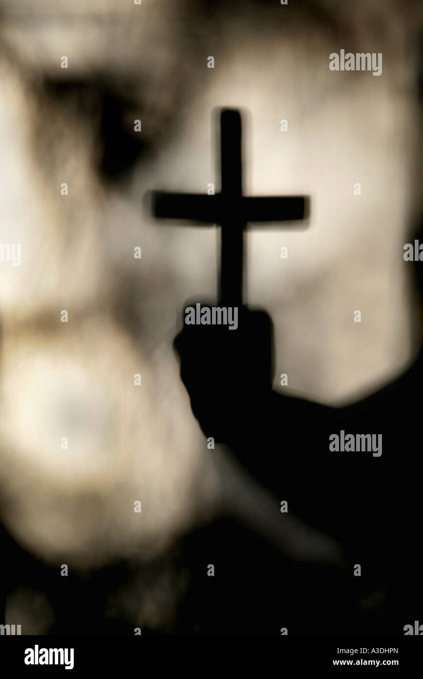Hand holding cross Stock Photo - Alamy