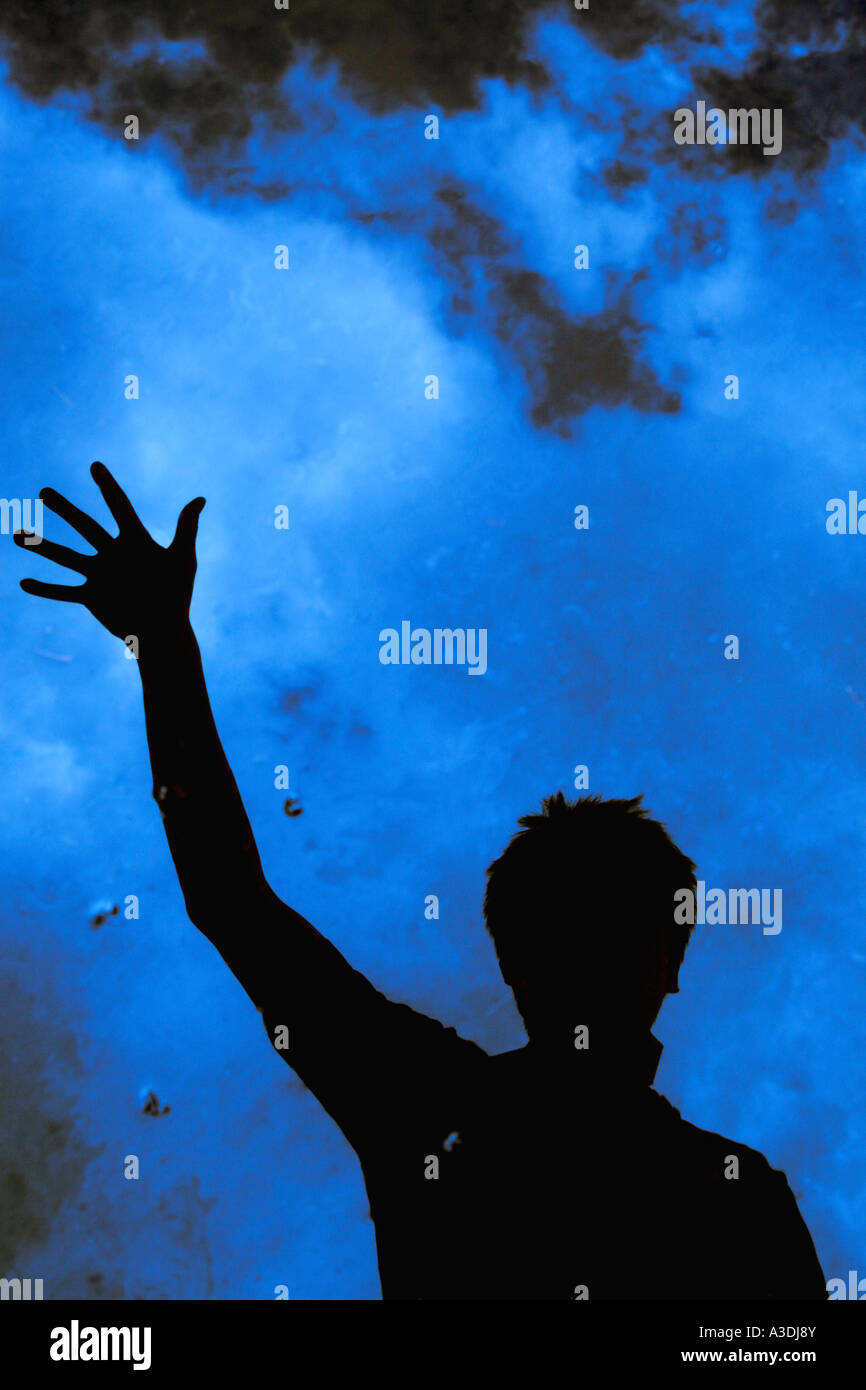 Person with hand raised Stock Photo - Alamy