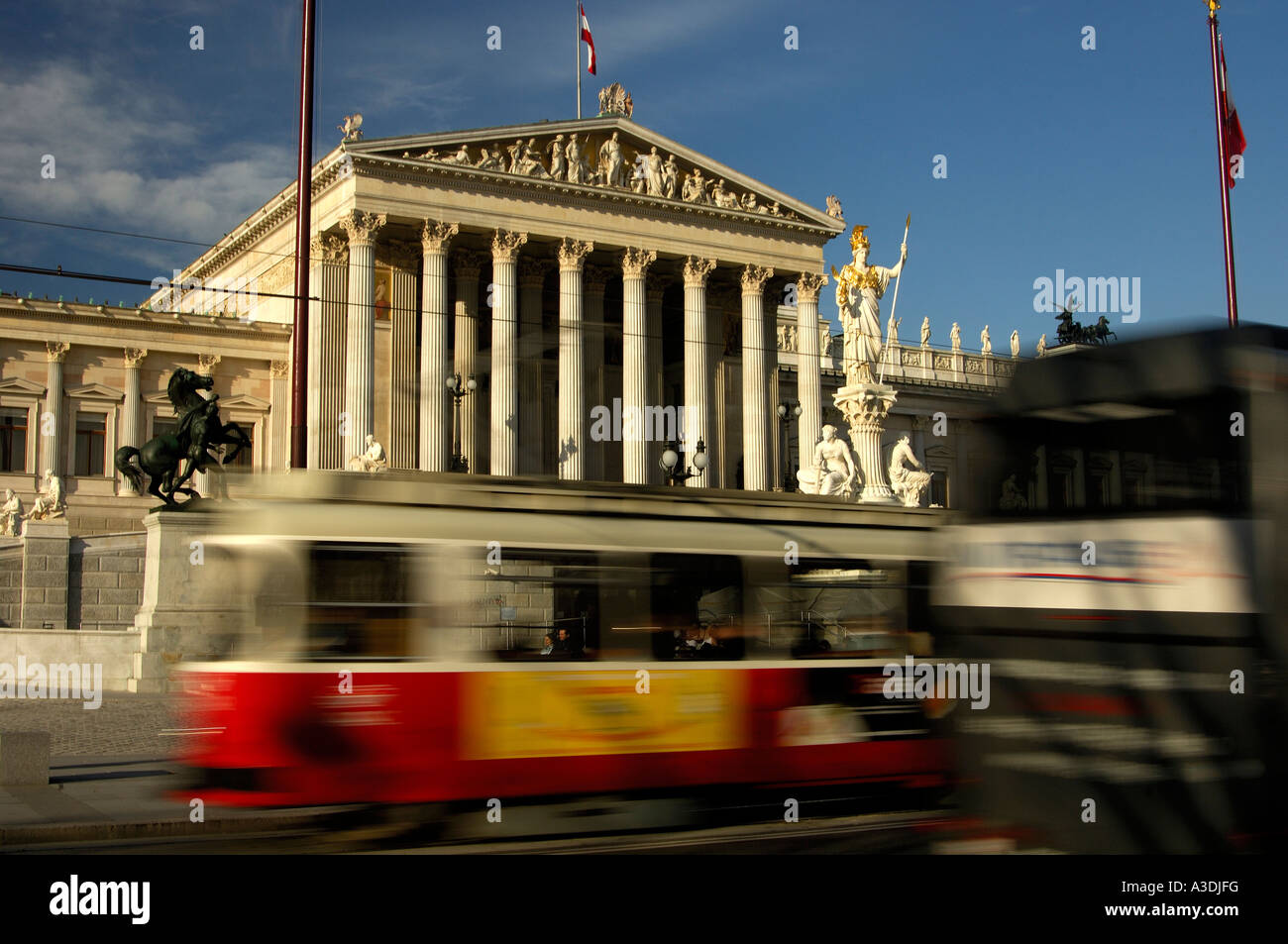 Heavy traffic on Ringstrasse passing the Parliament building and the ...
