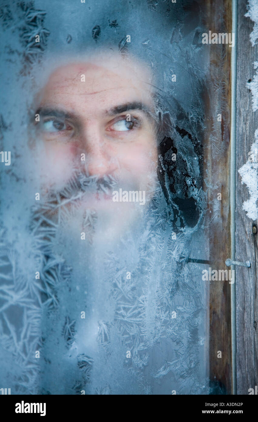 Man looking through frosted glass Stock Photo - Alamy