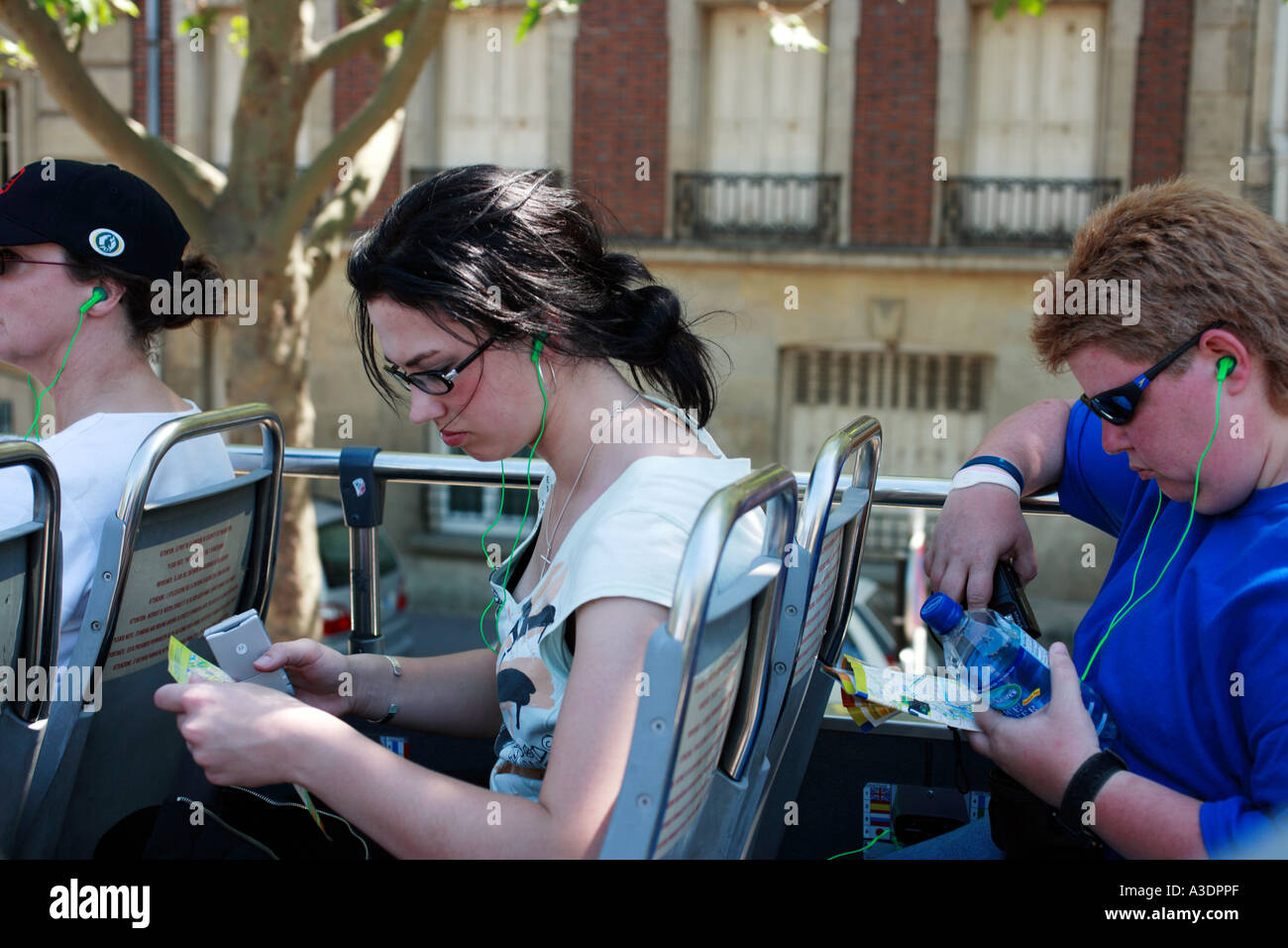 Tourists on open top bus in paris Stock Photo - Alamy