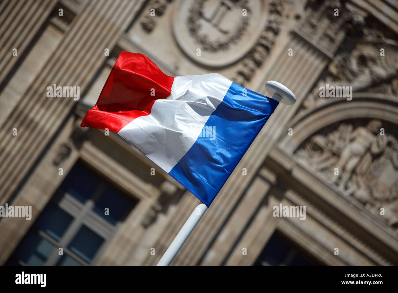 French flag infront of building Stock Photo - Alamy