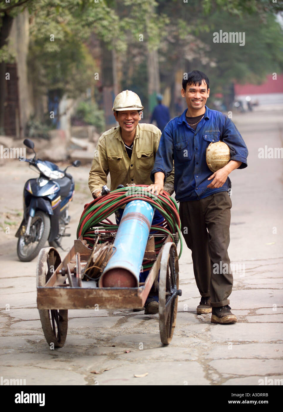 Workers pushing cart of equipment, Bach Dang Shipyard, Vietnam Stock ...