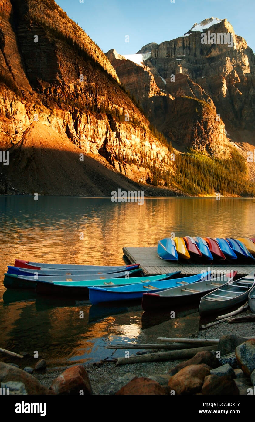 Mountain lake with canoes Stock Photo - Alamy
