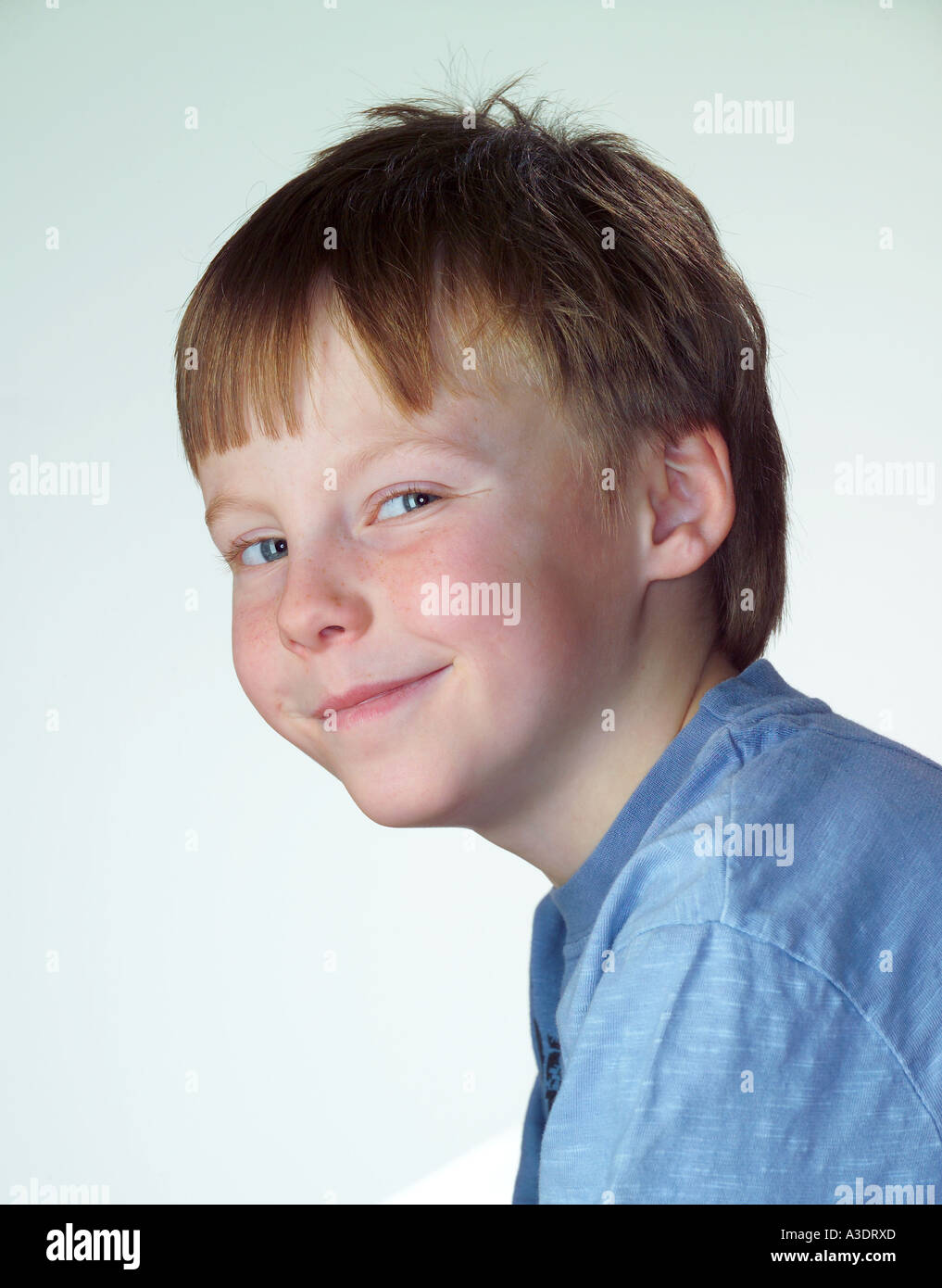 Portrait of smiling boy against white background Stock Photo - Alamy