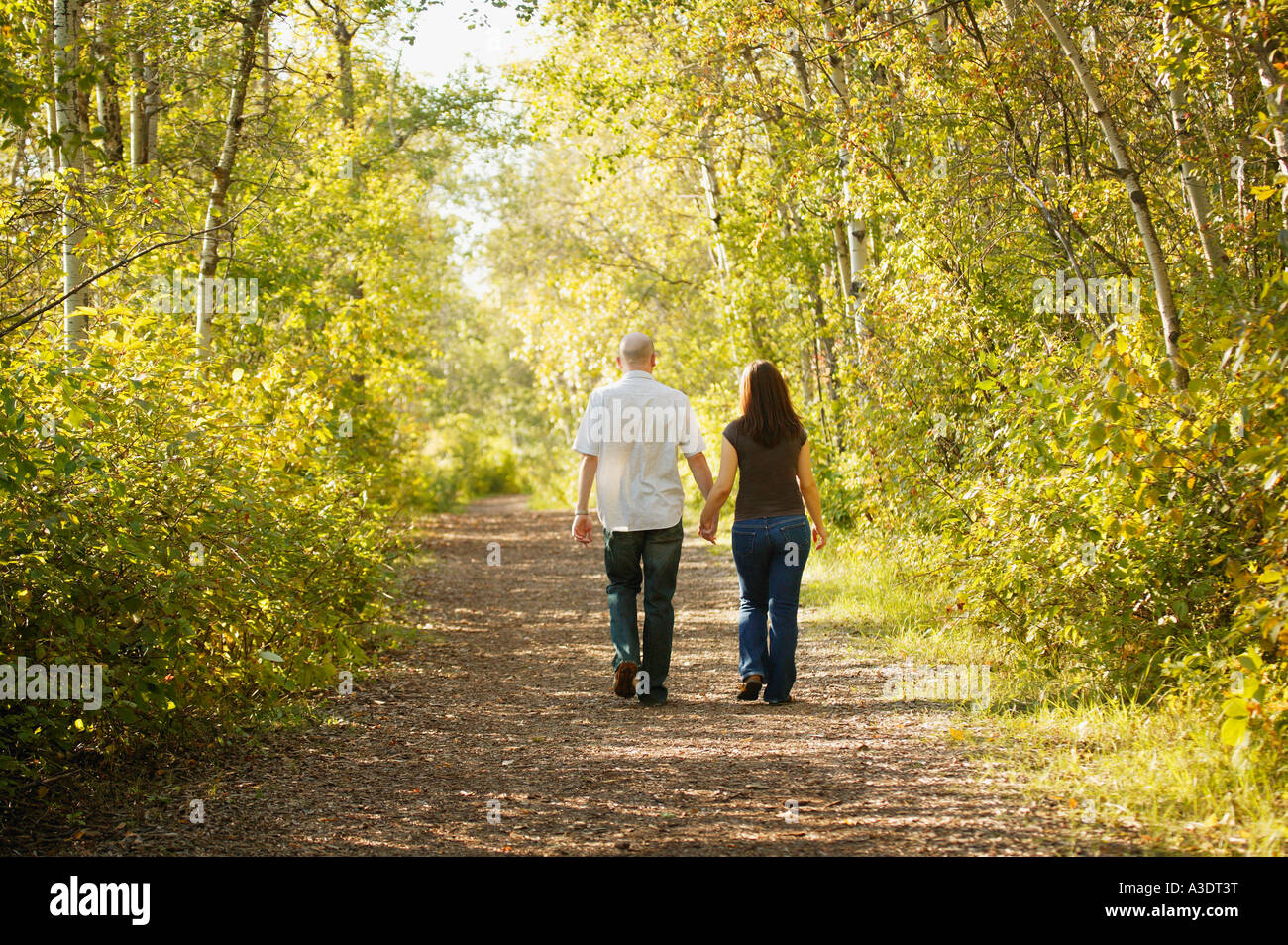 Couple Walking Down A Path