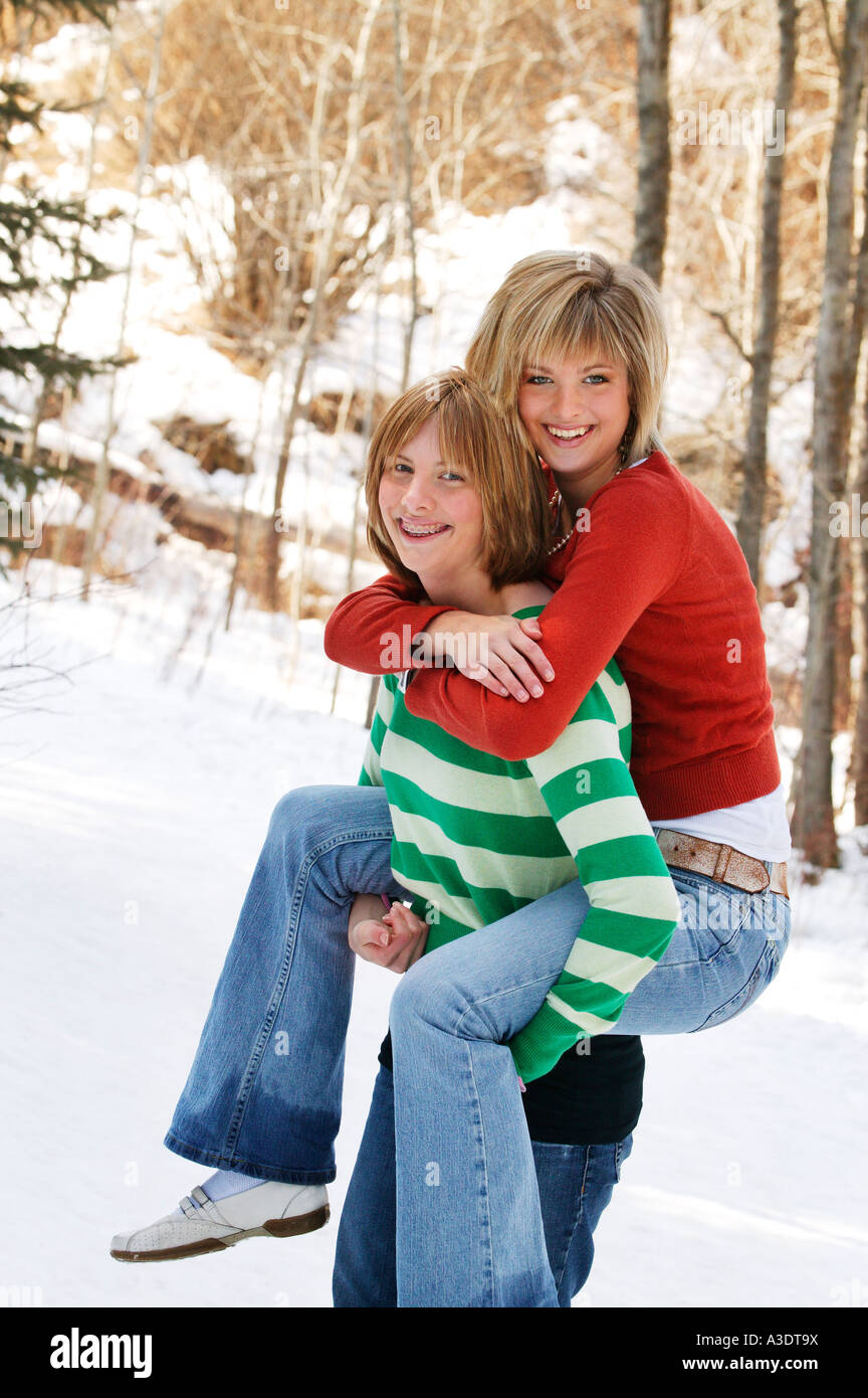 Daughter giving mom piggyback Stock Photo - Alamy