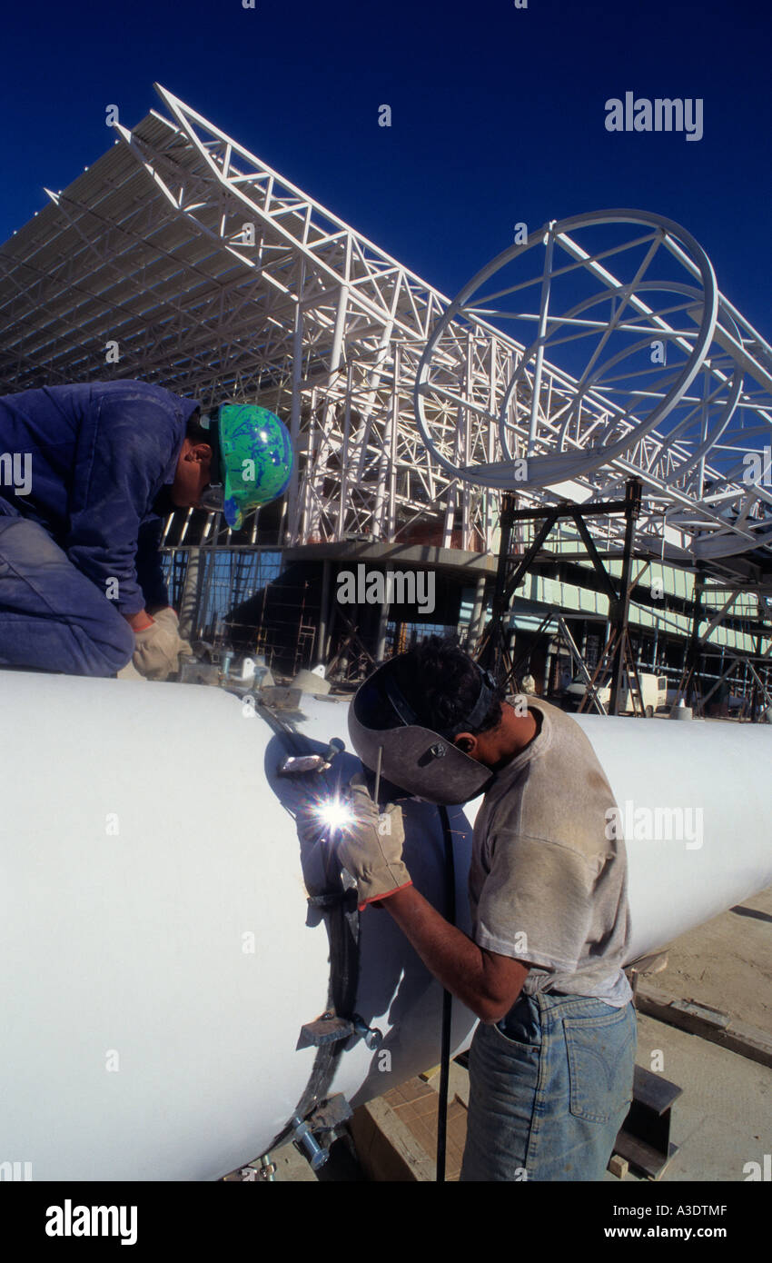 Solderer wearing a soldering mask working Stock Photo - Alamy
