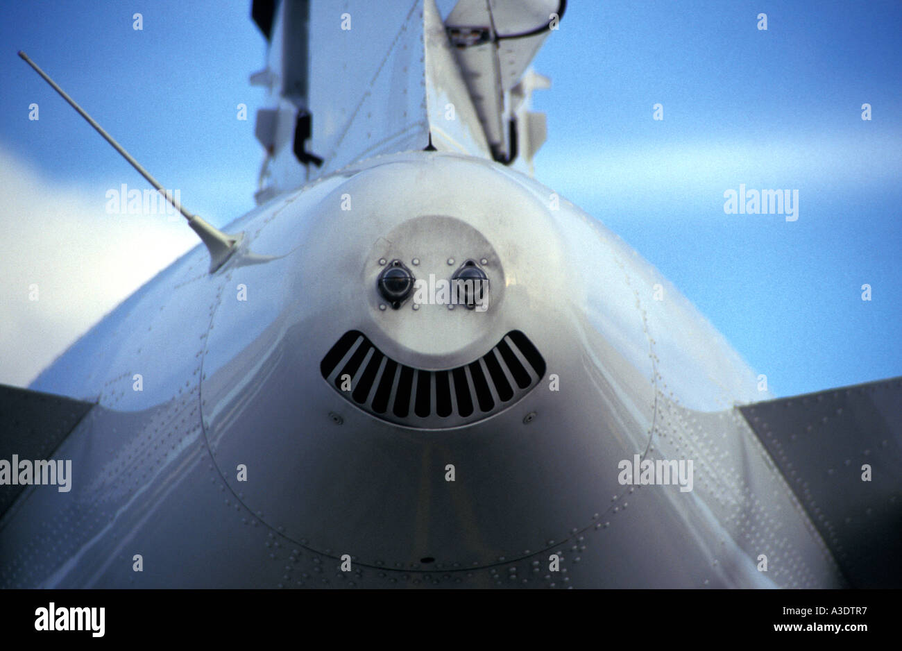 Tail end of Saab SF340 airliner looking like a face with uneasy smile ...