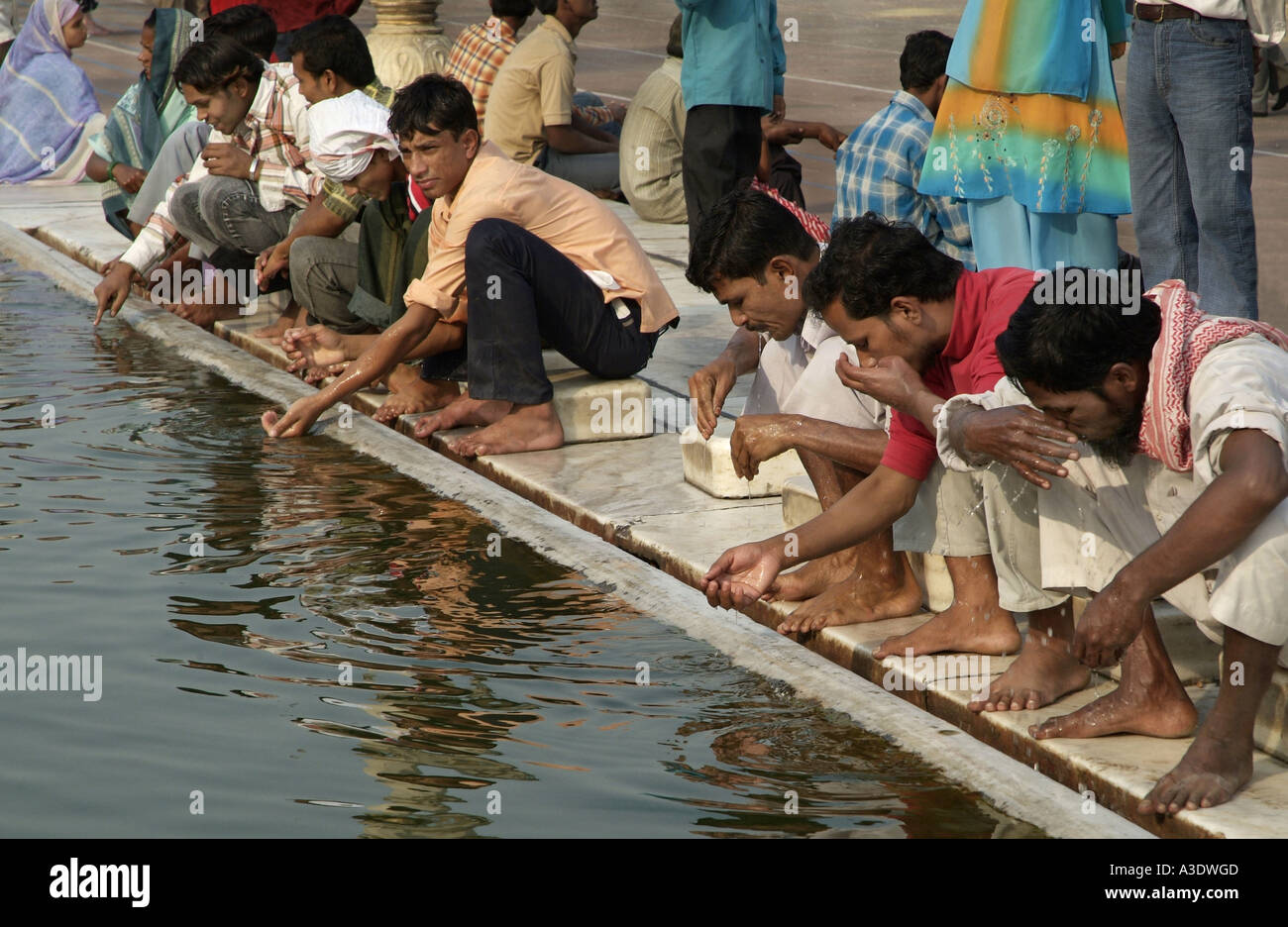 Men washing before prayer at the Jami Masjid Mosque in Delhi India ...