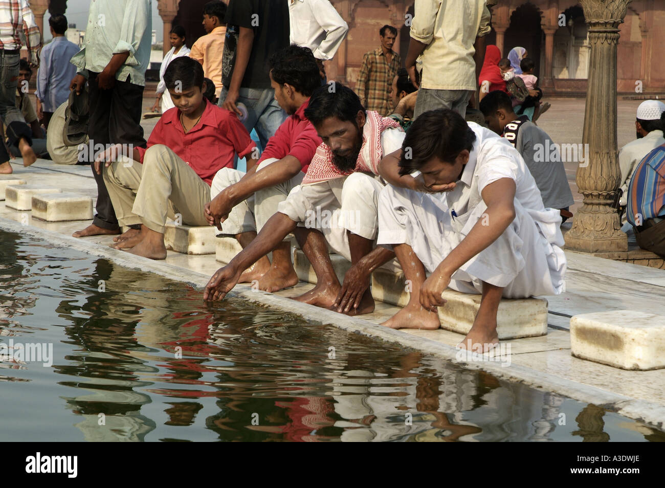 Men washing before prayer at the Jami Masjid Mosque in Delhi India ...