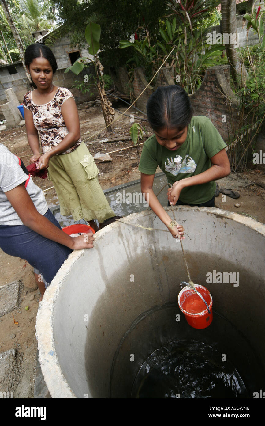 Women Drawing Water From A Well High Resolution Stock Photography and ...
