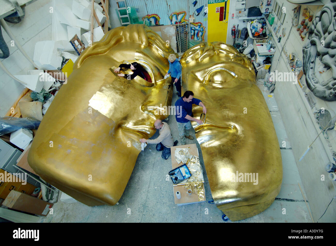 Artist in studio creating a giant BAFTA mask for the 2007 British ...