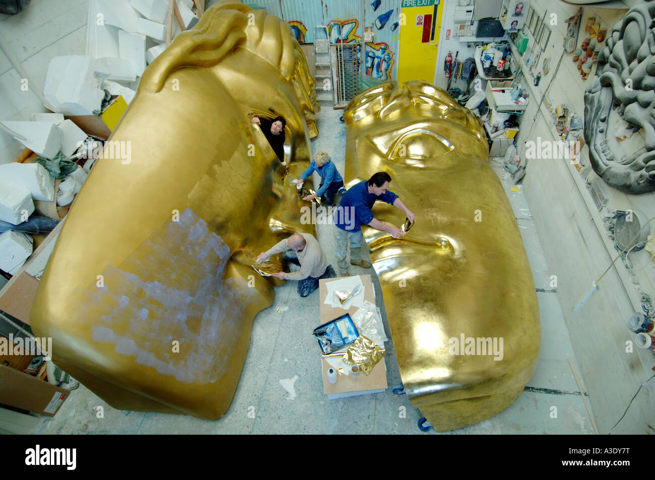 Artist in studio creating a giant BAFTA mask for the 2007 British ...