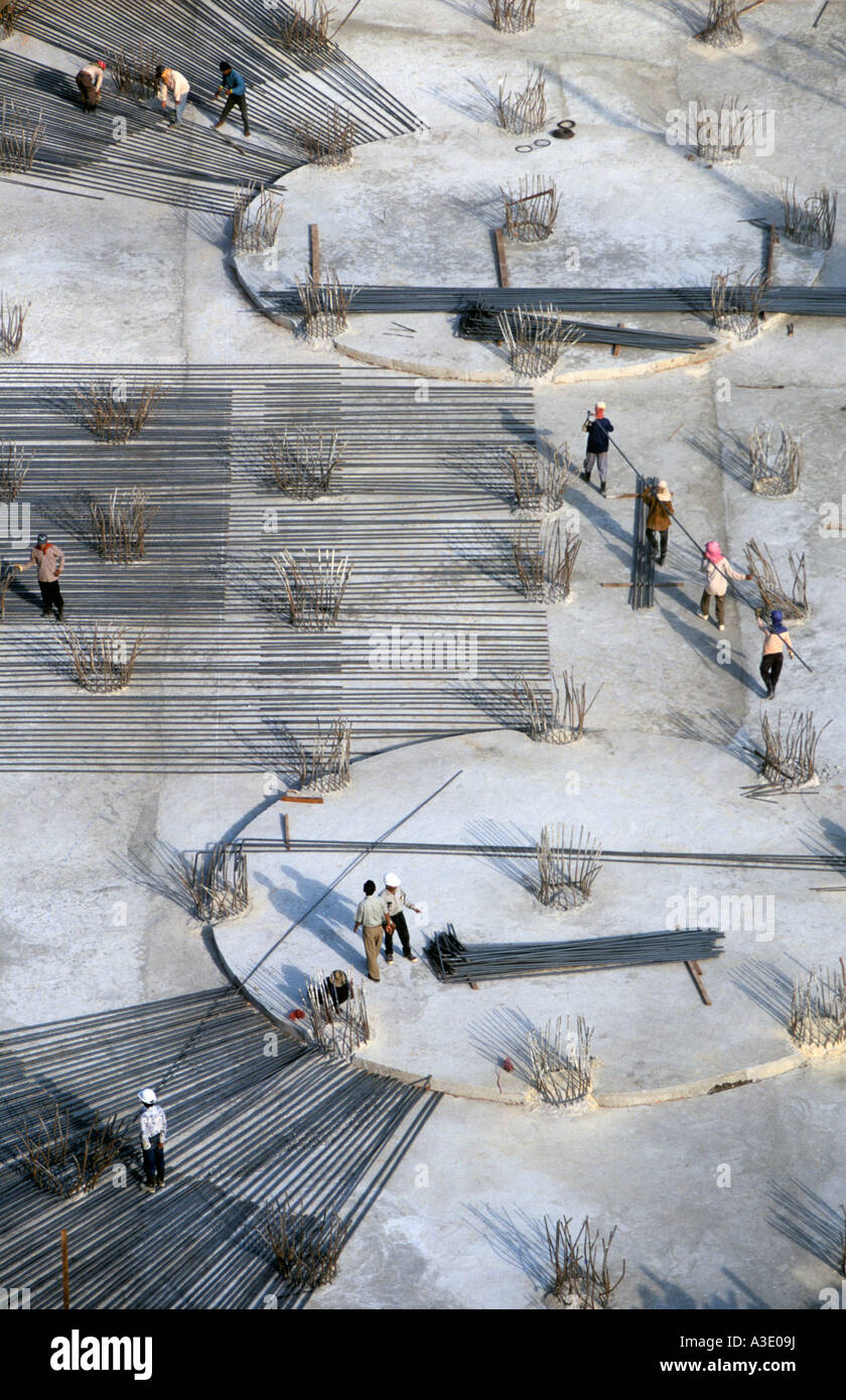 Worker carrying rebar hi-res stock photography and images - Alamy