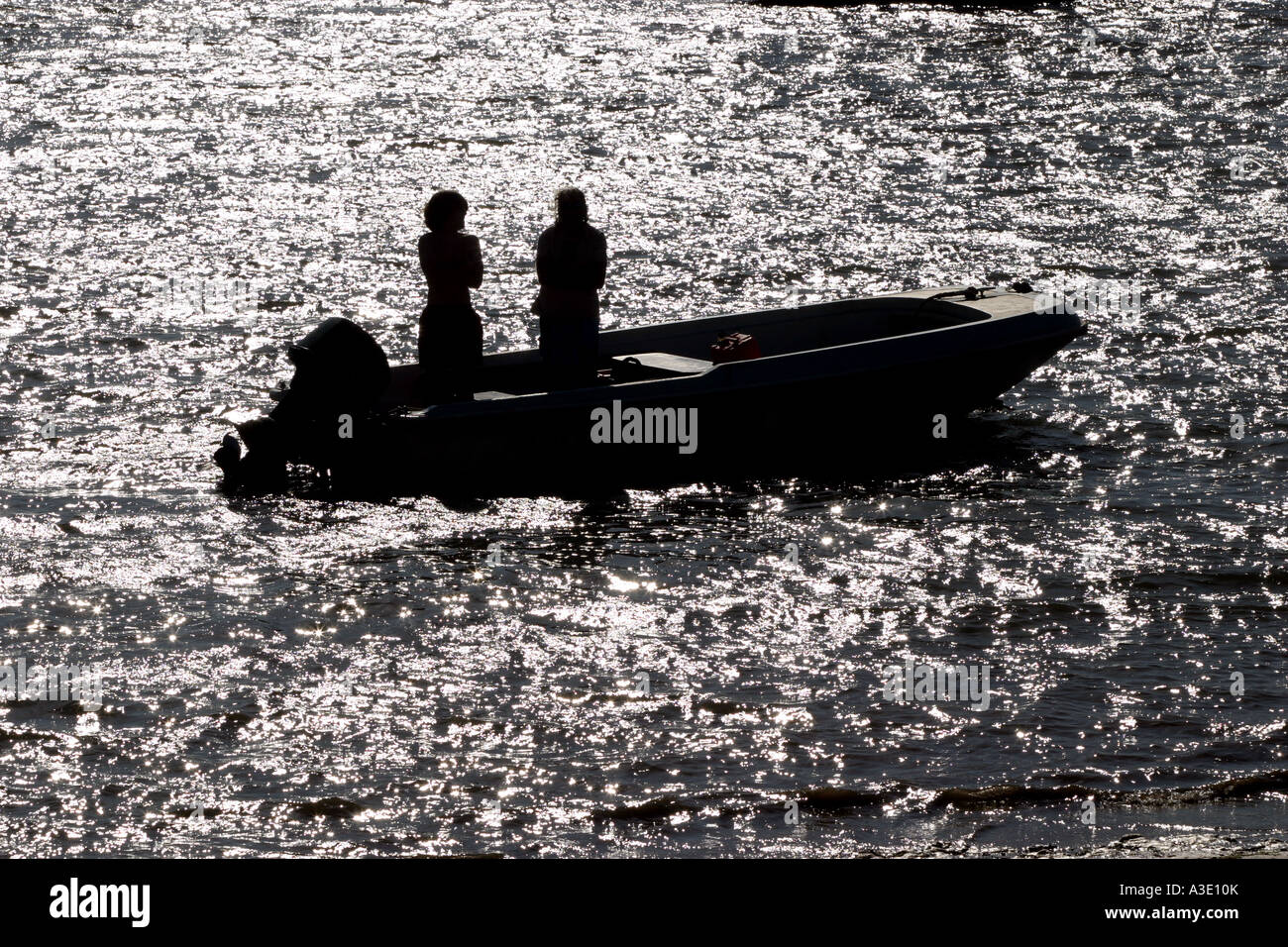 two anonymous men in a boat Stock Photo - Alamy