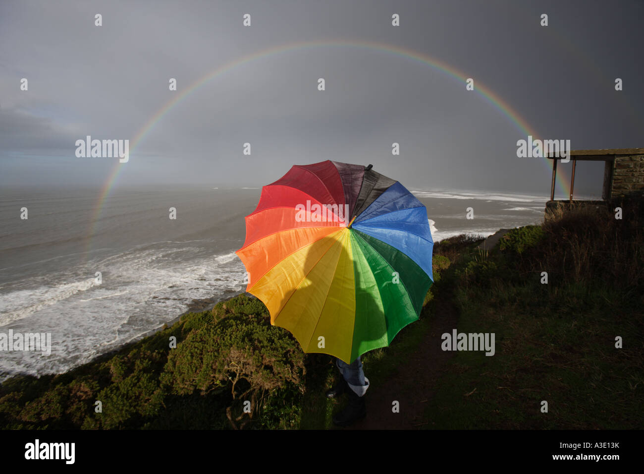 Multicoloured umbrella under a rainbow hi-res stock photography and ...