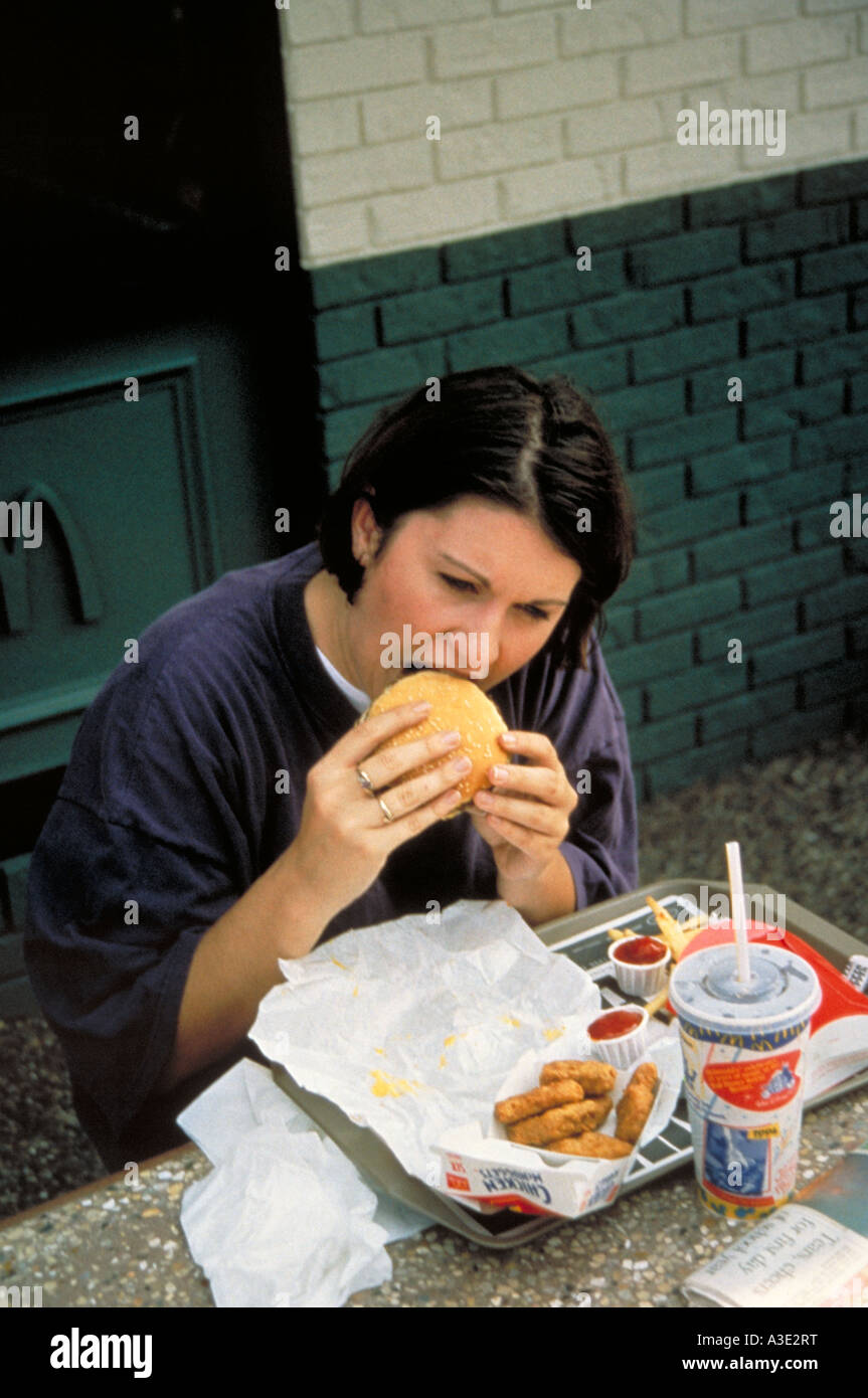 Young woman eating fast food. St. Paul, Minnesota Stock Photo - Alamy