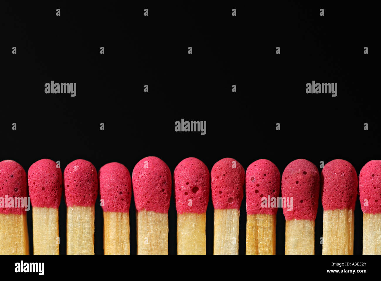 Red Headed Matches Lined Up Against a Black Background Stock Photo - Alamy