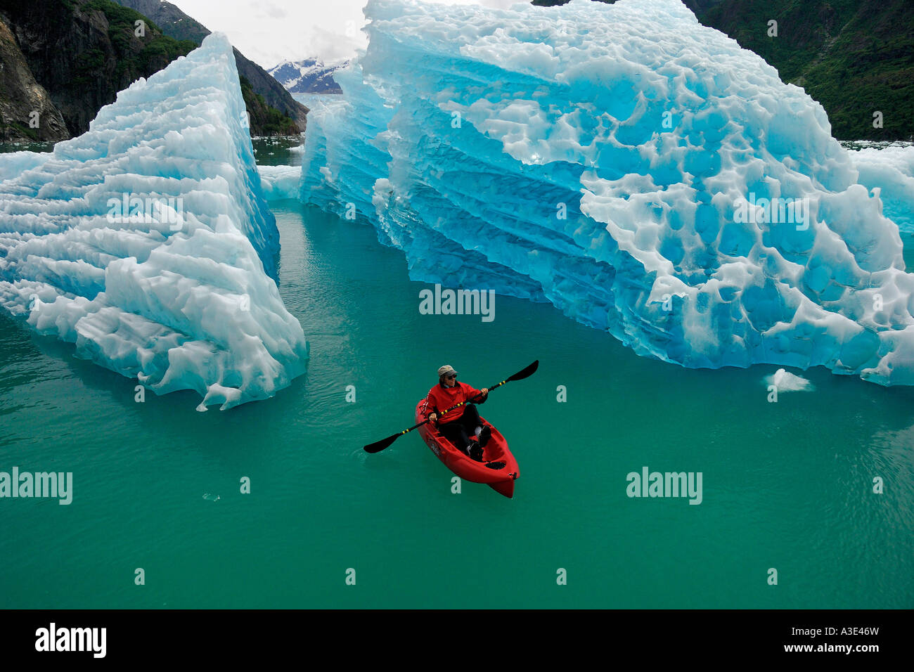 Exploring an iceberg by sea kayak in Tracy Arm Alaska Pacific Ocean ...