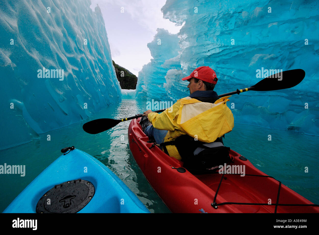 Exploring an iceberg by sea kayak in Tracy Arm Alaska Pacific Ocean ...
