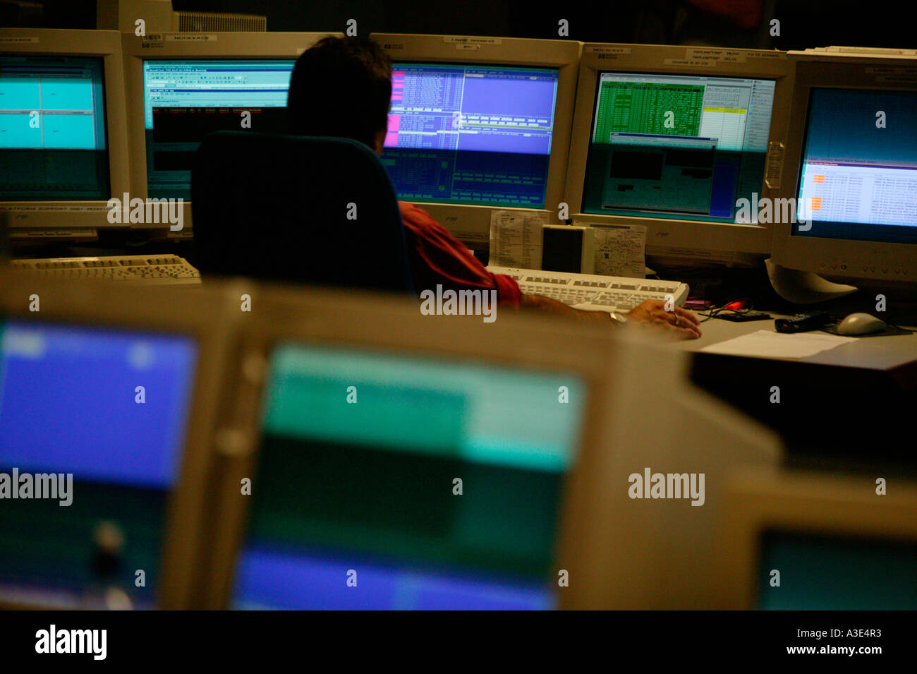 Computer room, people looking at screens Stock Photo - Alamy