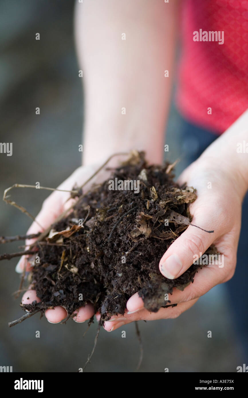 Hands holding home made compost at the Centre for Alternative ...