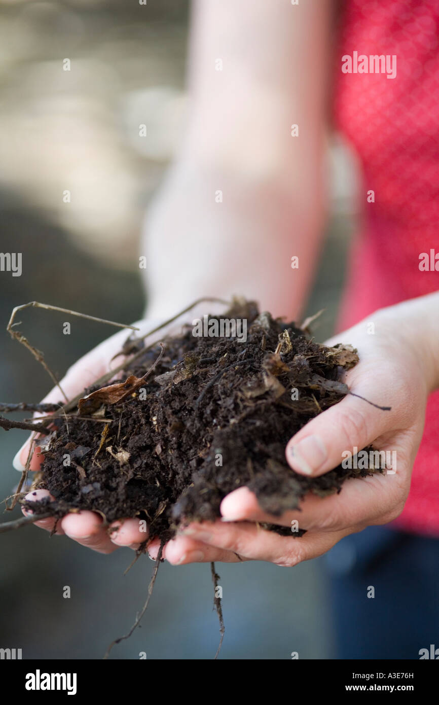 Hands holding home made compost at the Centre for Alternative ...